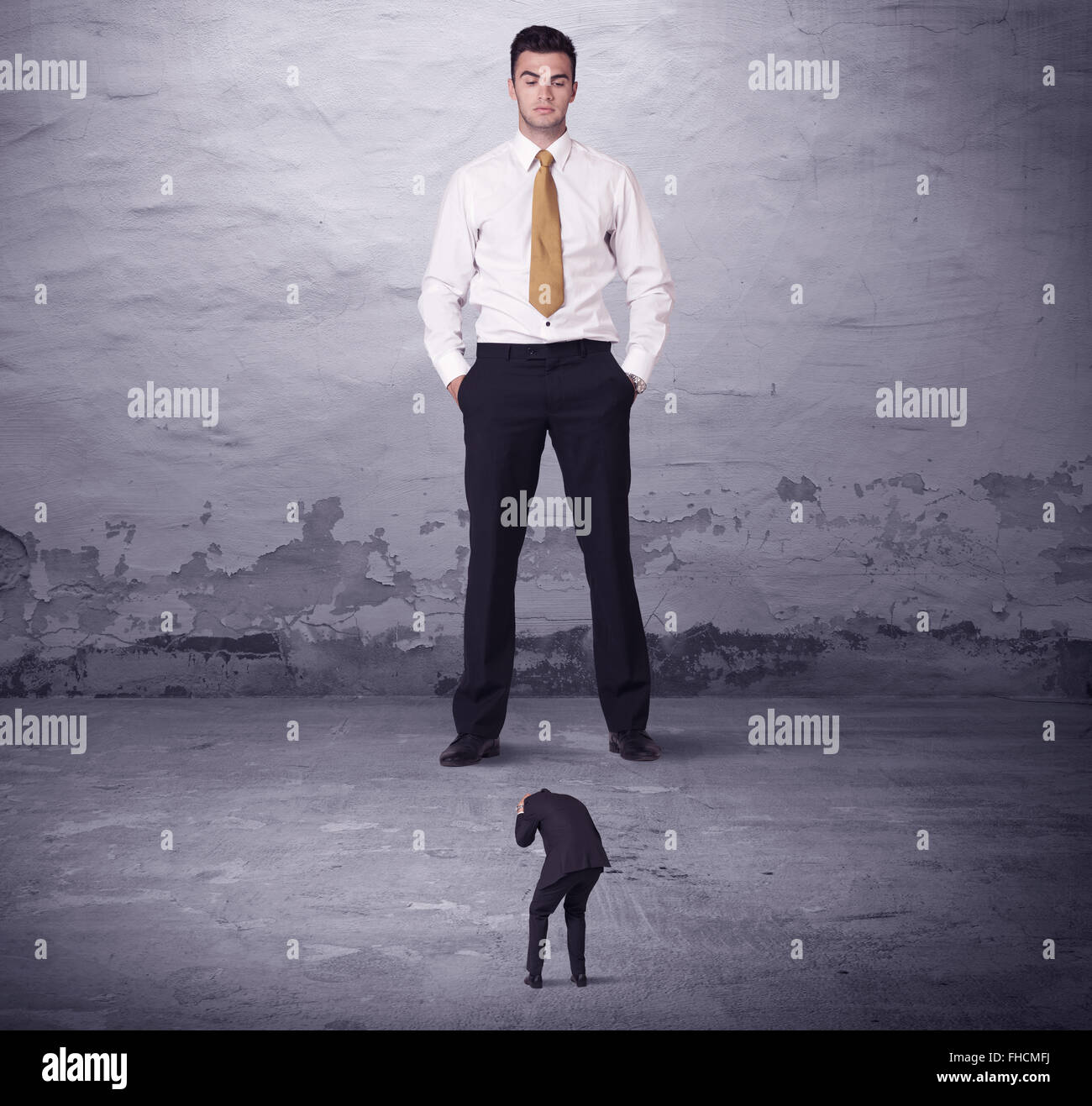 Angry big manager looking at small business man Stock Photo - Alamy