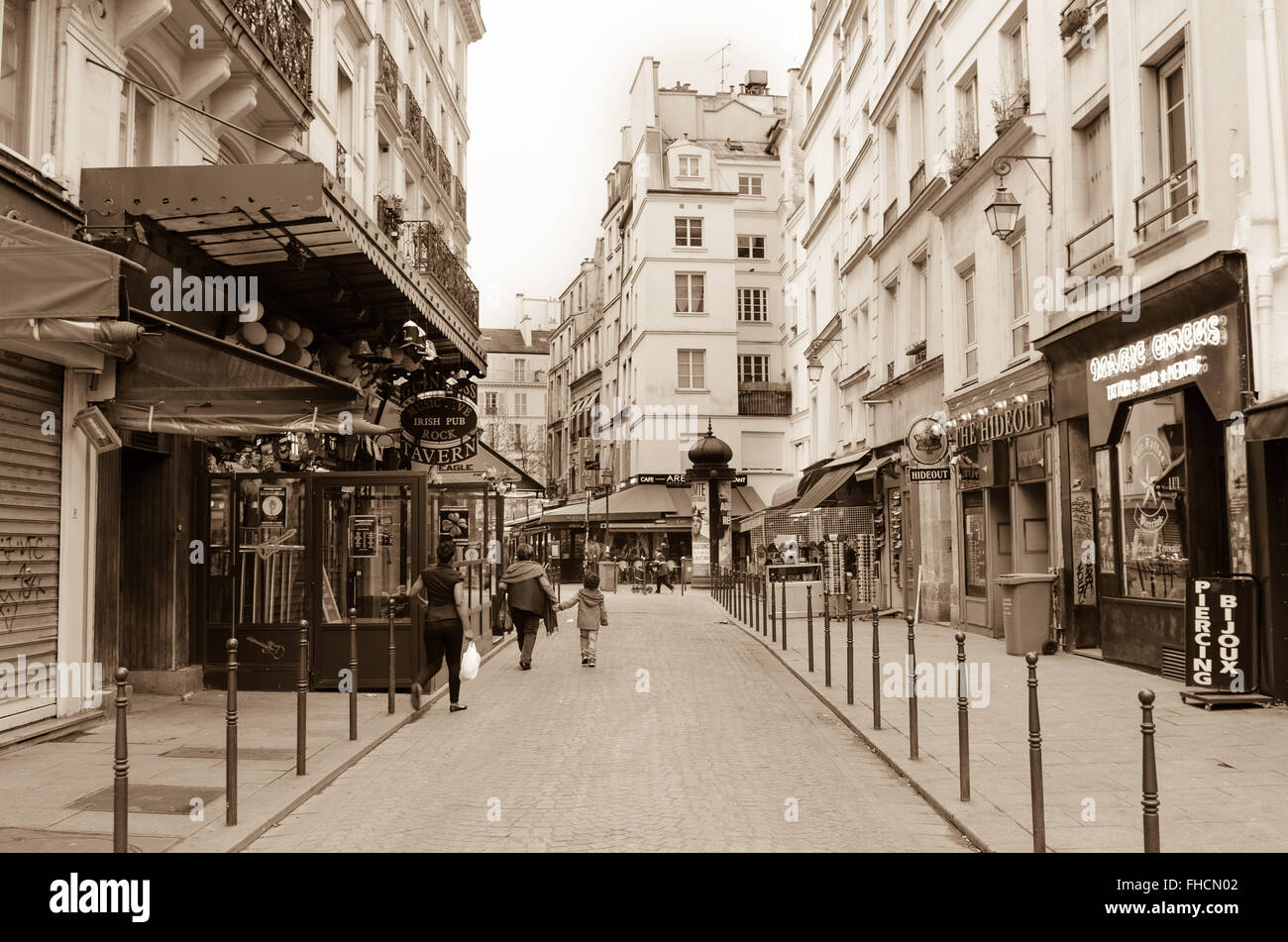 stores view of typical street in Paris France Stock Photo - Alamy