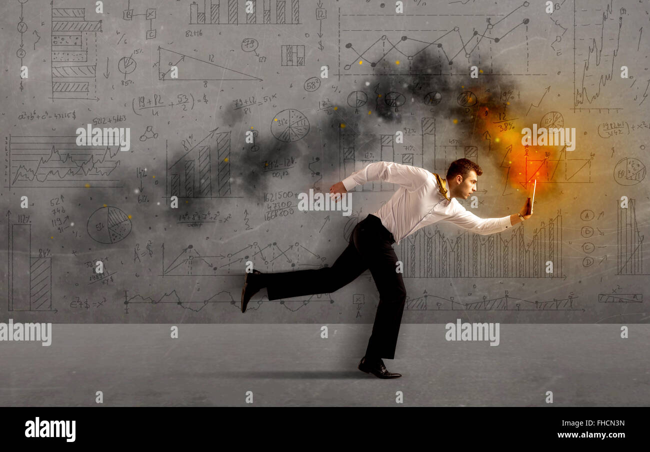 Running business man with fire laptop Stock Photo - Alamy