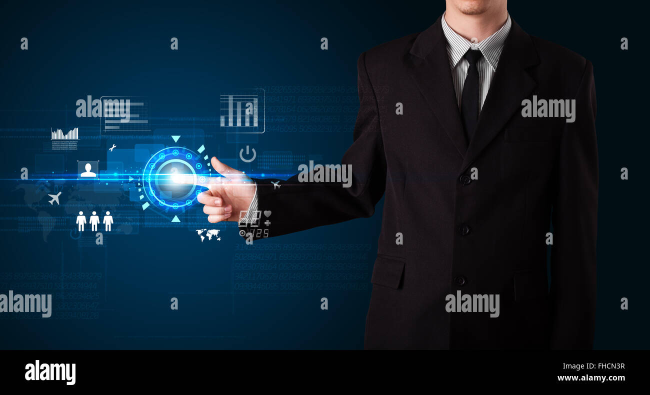 Handsome businessman touching future web technology buttons and icons ...