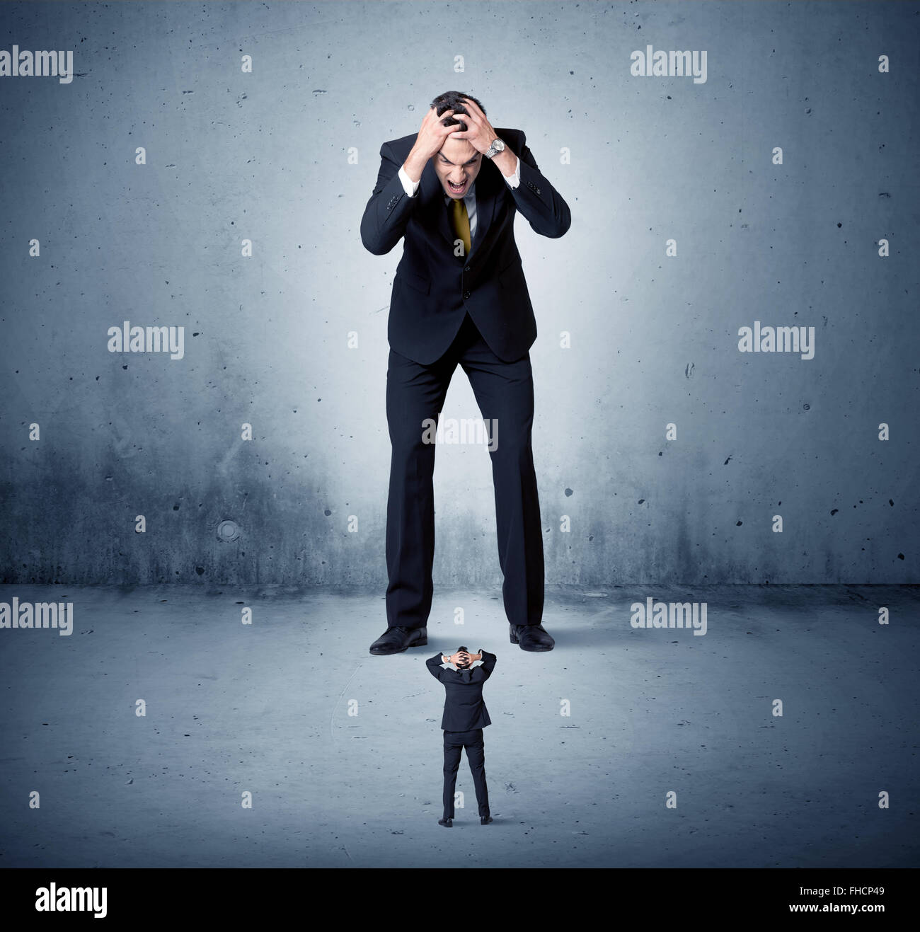 Angry huge business man lokking at small guy Stock Photo - Alamy