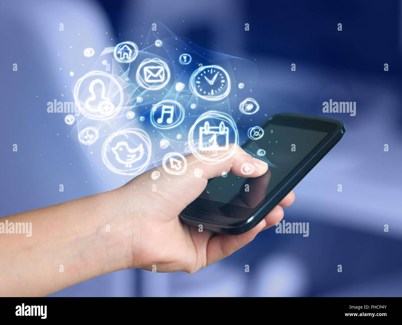 Hand holding smartphone with mobile app choices Stock Photo - Alamy