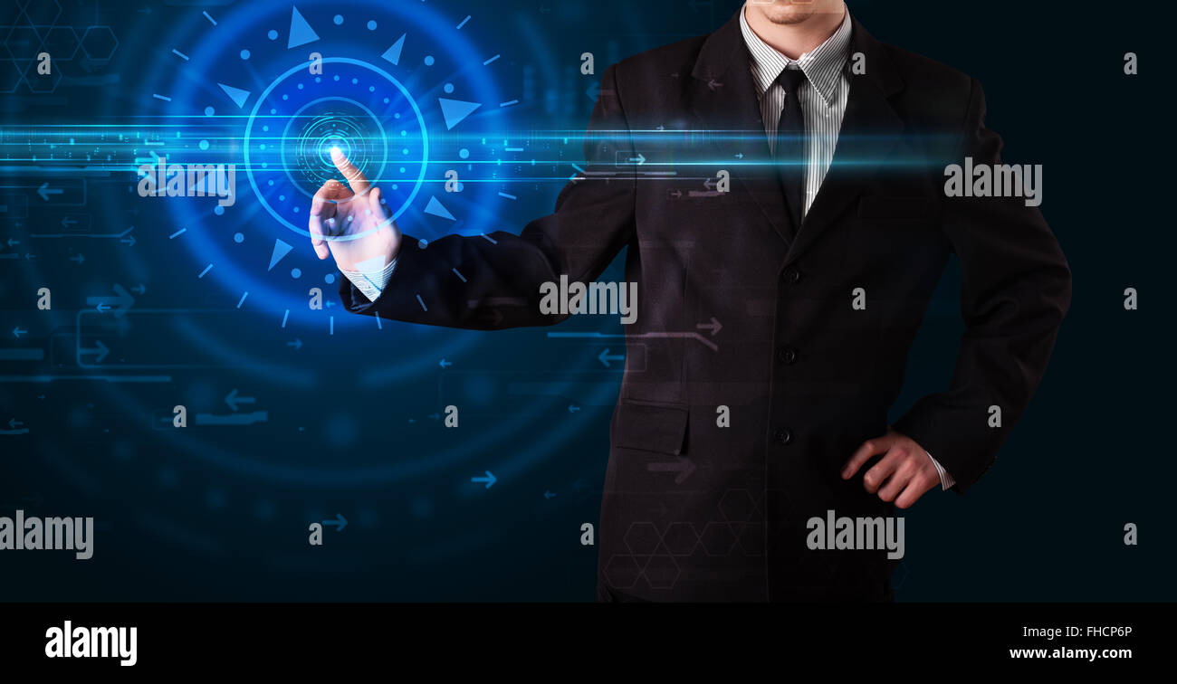 Handsome tech guy pressing high technology control panel screen concept ...
