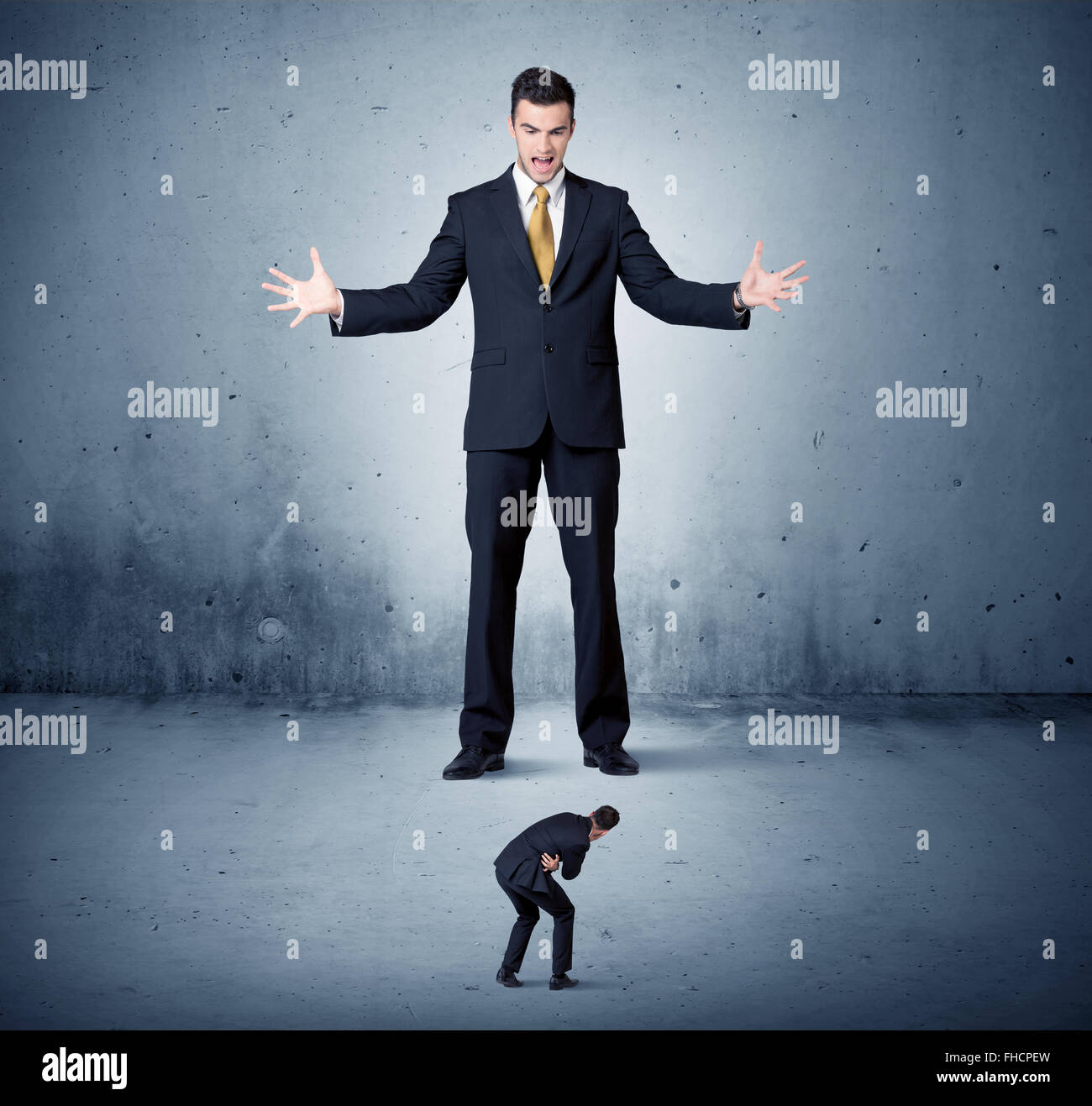 Angry huge business man lokking at small guy Stock Photo - Alamy
