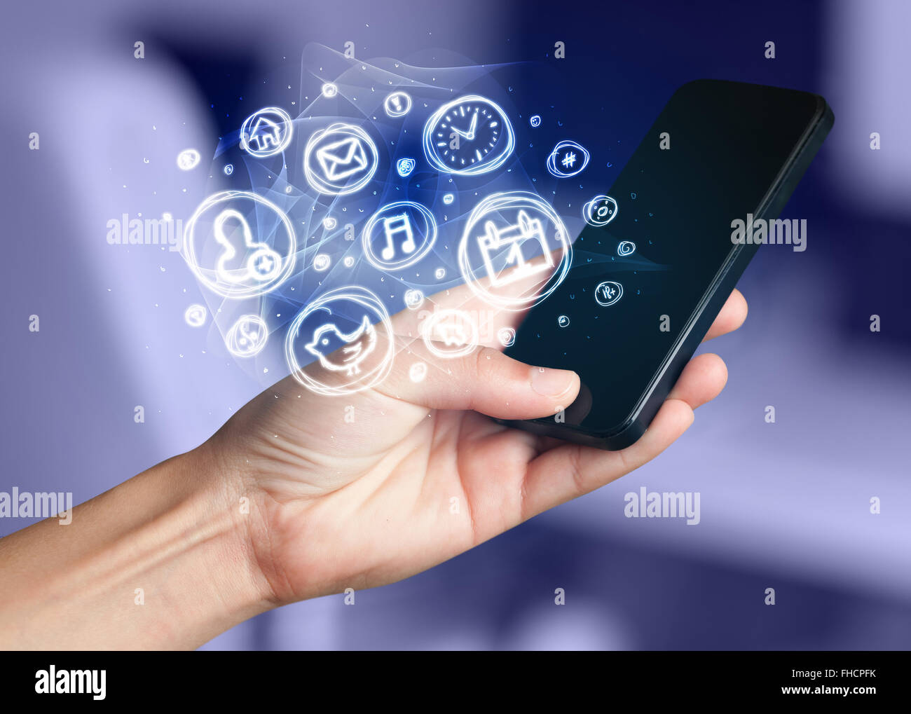 Hand holding smartphone with mobile app choices Stock Photo - Alamy