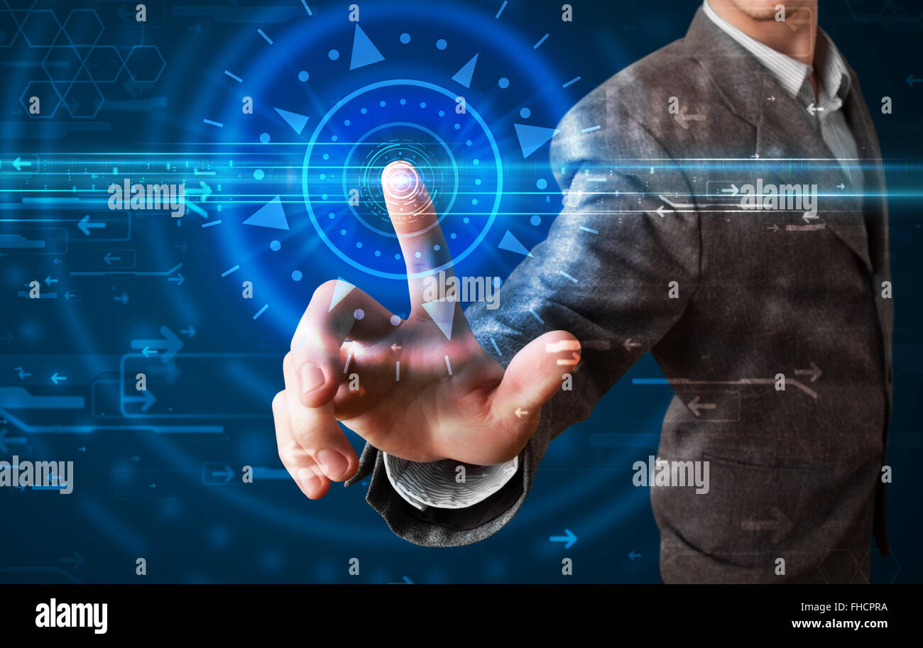 Handsome tech guy pressing high technology control panel screen concept ...