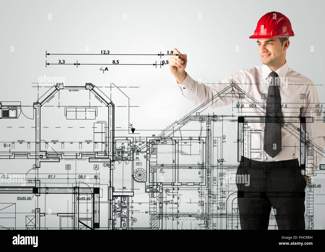 An young architect drawing a house plan Stock Photo - Alamy
