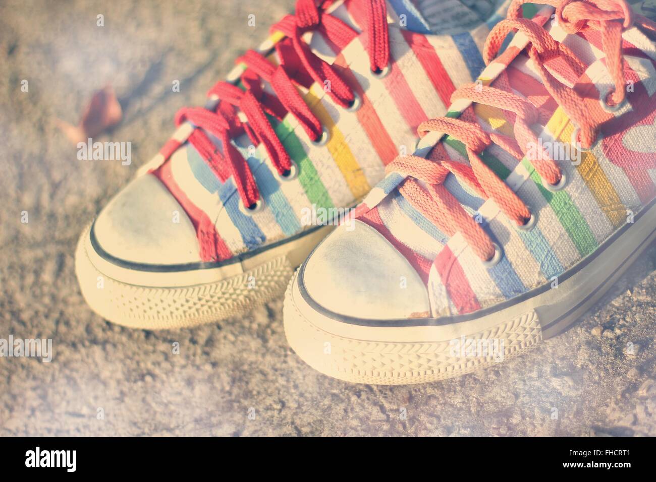 Colour canvas shoes in vintage filter style Stock Photo - Alamy