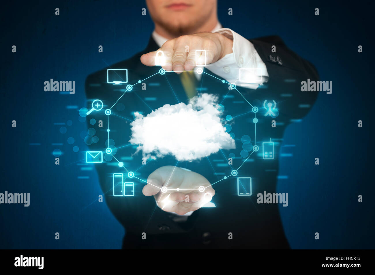 Businessman holding digital icons Stock Photo - Alamy