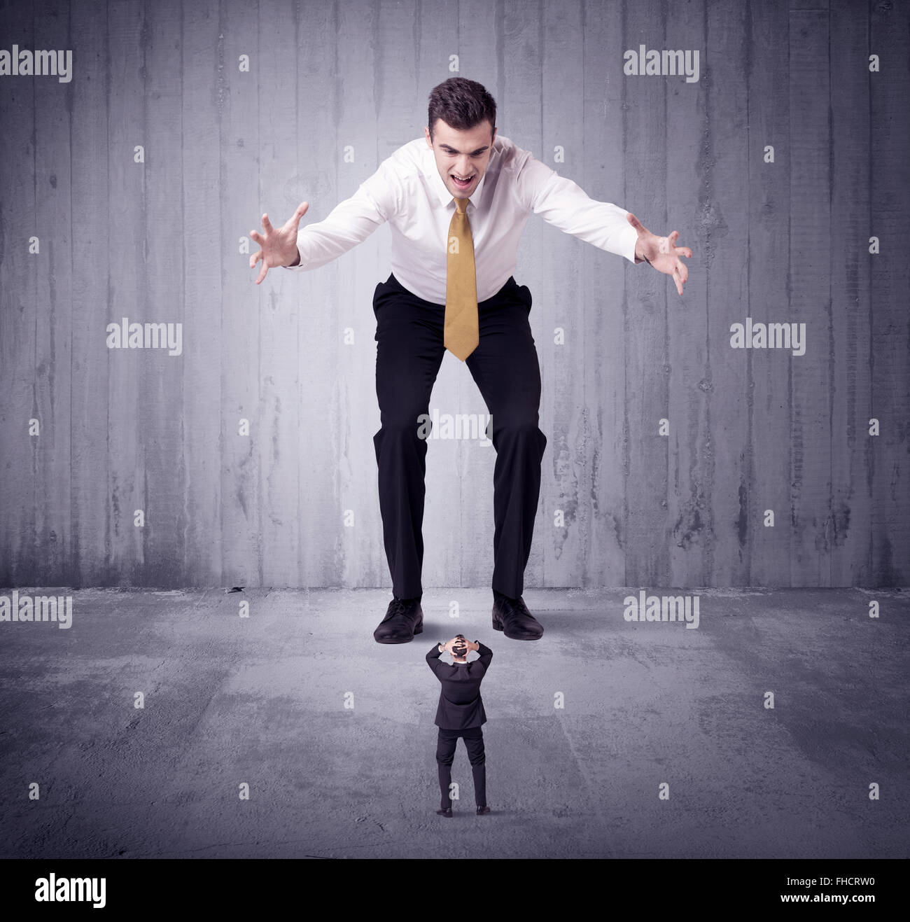Huge boss lokking at small business man Stock Photo - Alamy
