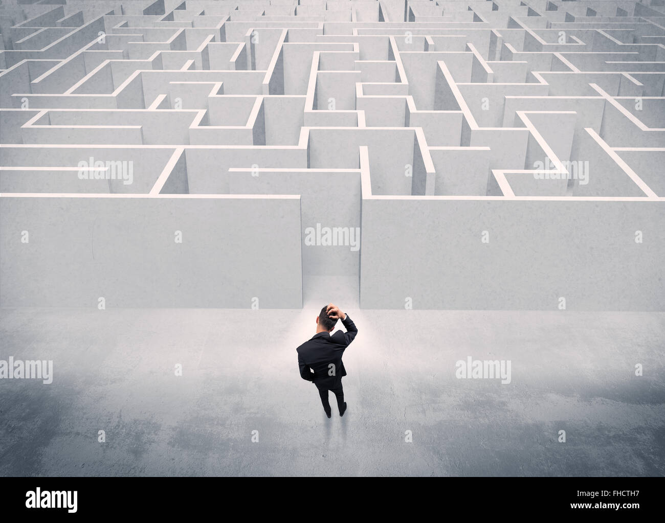 Sales person standing at maze entrance Stock Photo - Alamy