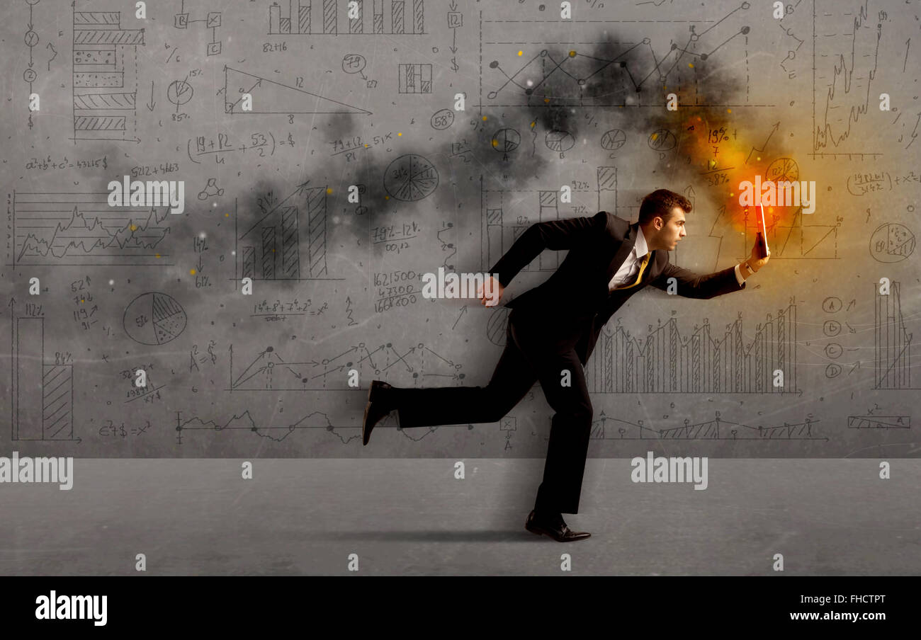 Running business man with fire laptop Stock Photo - Alamy