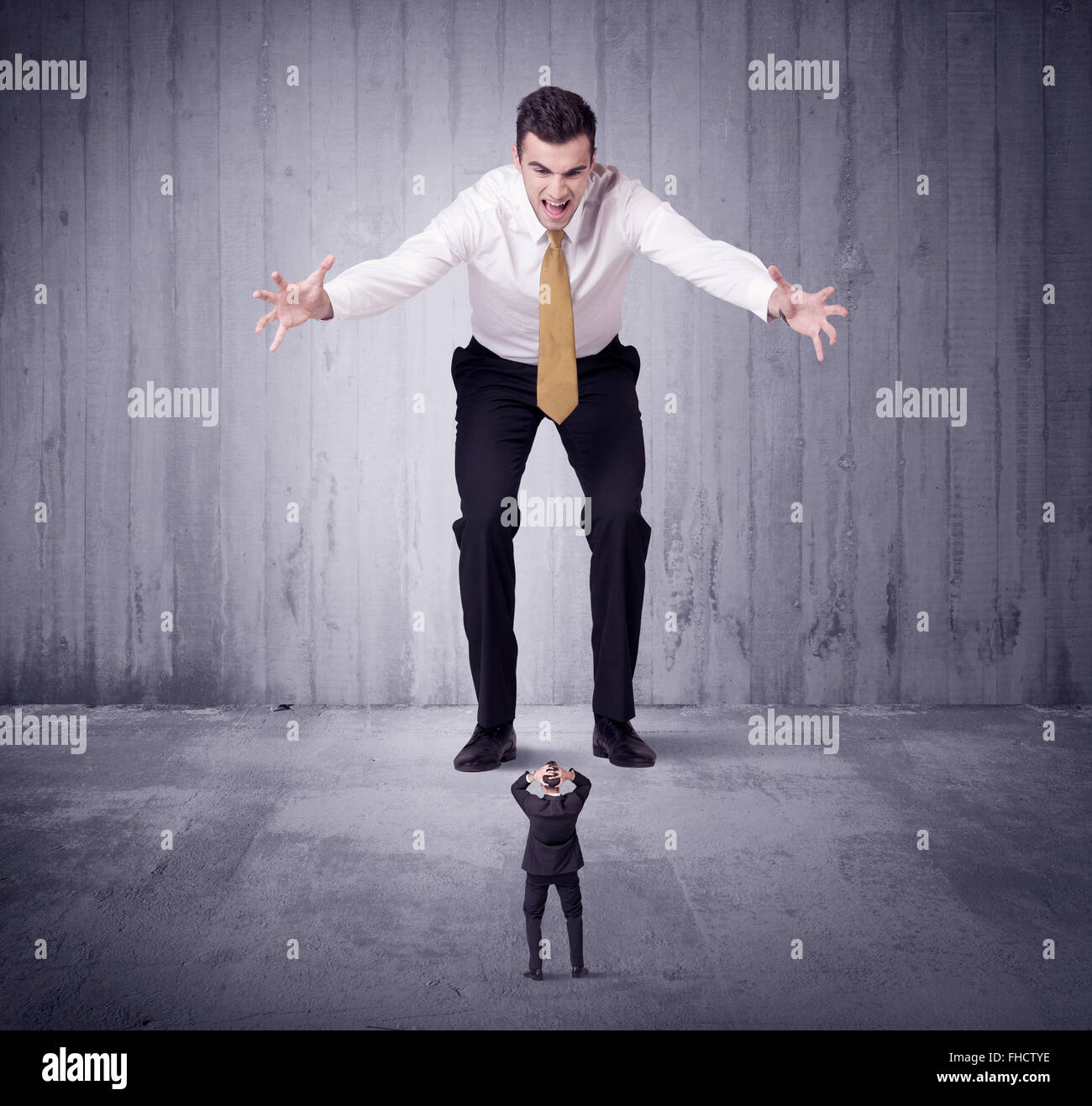 Huge boss lokking at small business man Stock Photo - Alamy