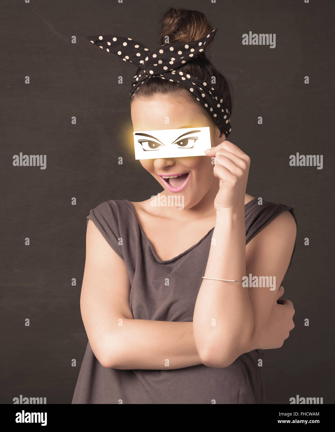 Cool youngster looking with a paper hand drawn eyes Stock Photo - Alamy