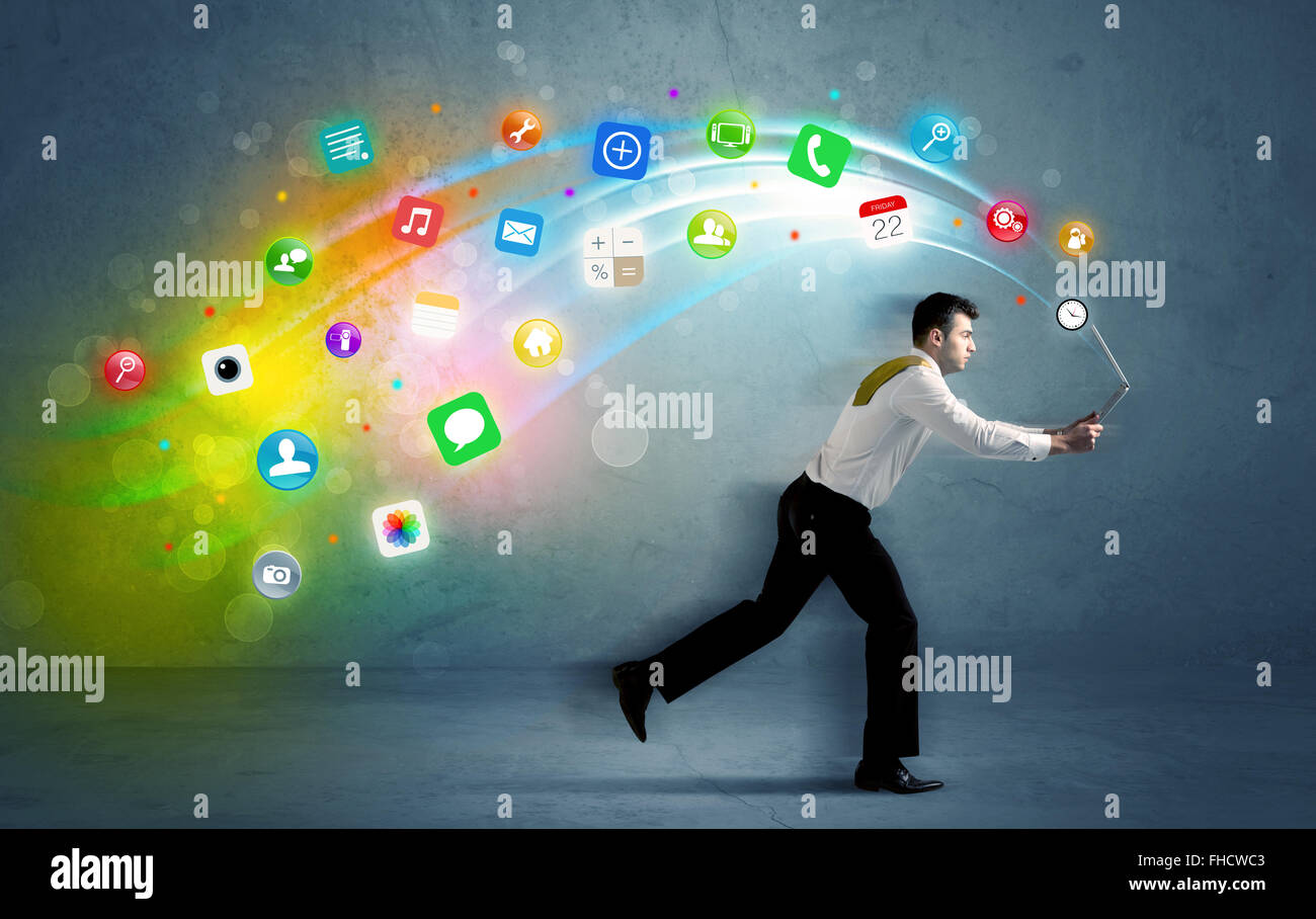 Running businessman with application icons from device Stock Photo - Alamy