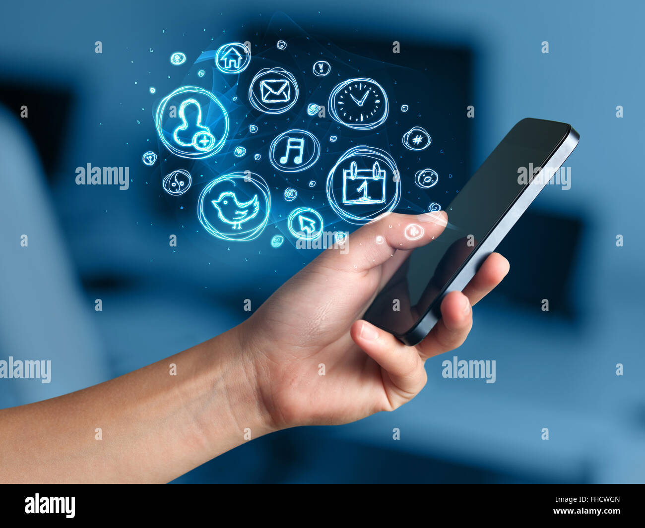 Hand holding smartphone with mobile app choices Stock Photo - Alamy