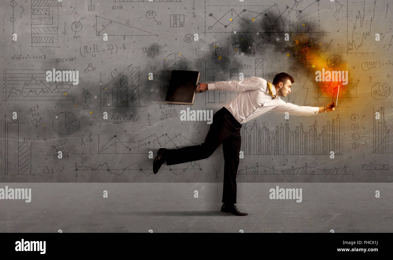 Running business man with fire laptop Stock Photo - Alamy