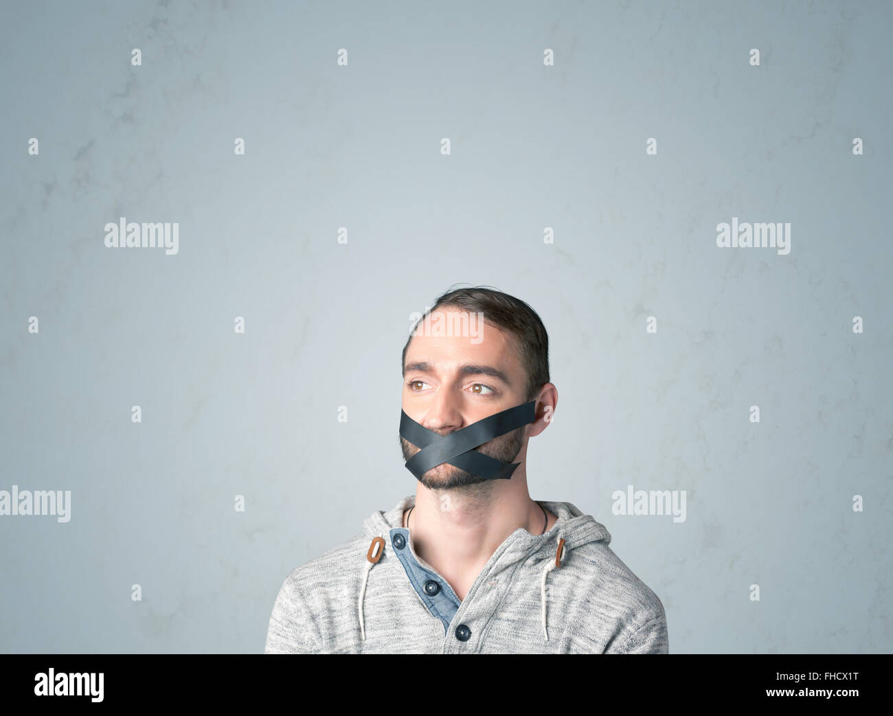 Young man with glued mouth Stock Photo - Alamy