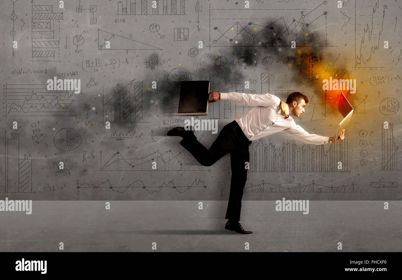 Running business man with fire laptop Stock Photo - Alamy