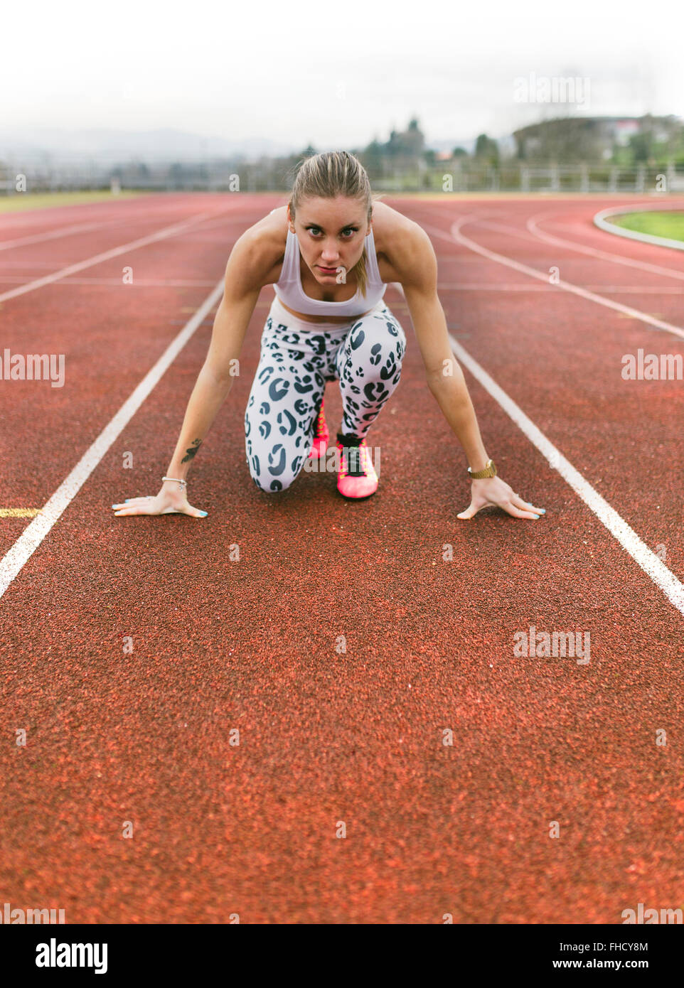 Athlete woman on a running track Stock Photo - Alamy