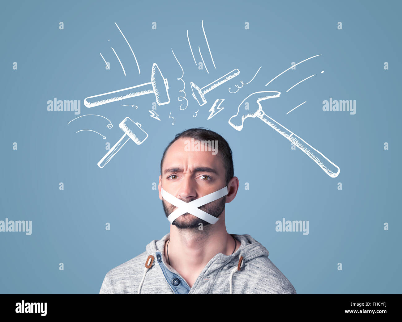 Young man with glued mouth and beating hammer marks Stock Photo - Alamy