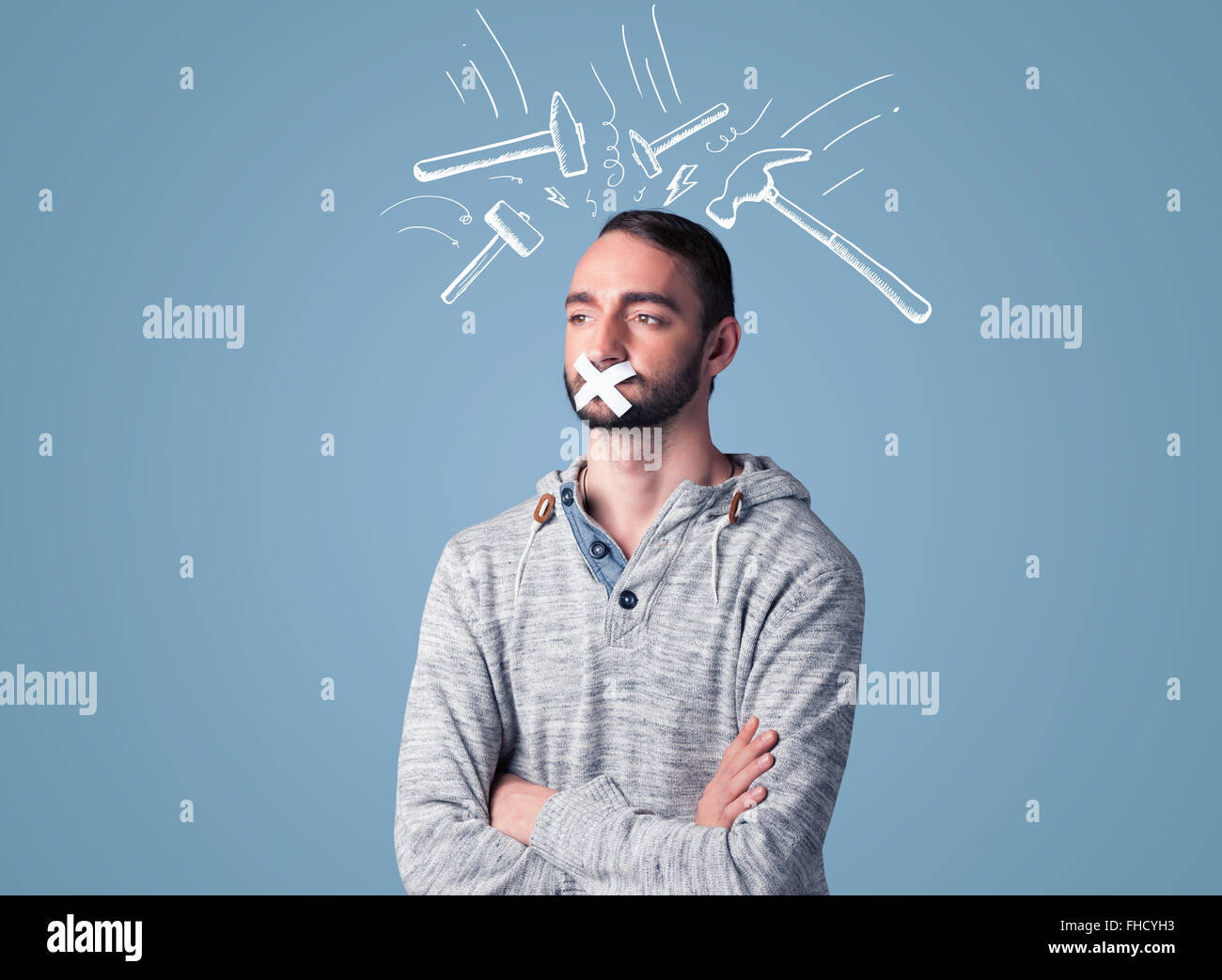 Young man with glued mouth and beating hammer marks Stock Photo - Alamy