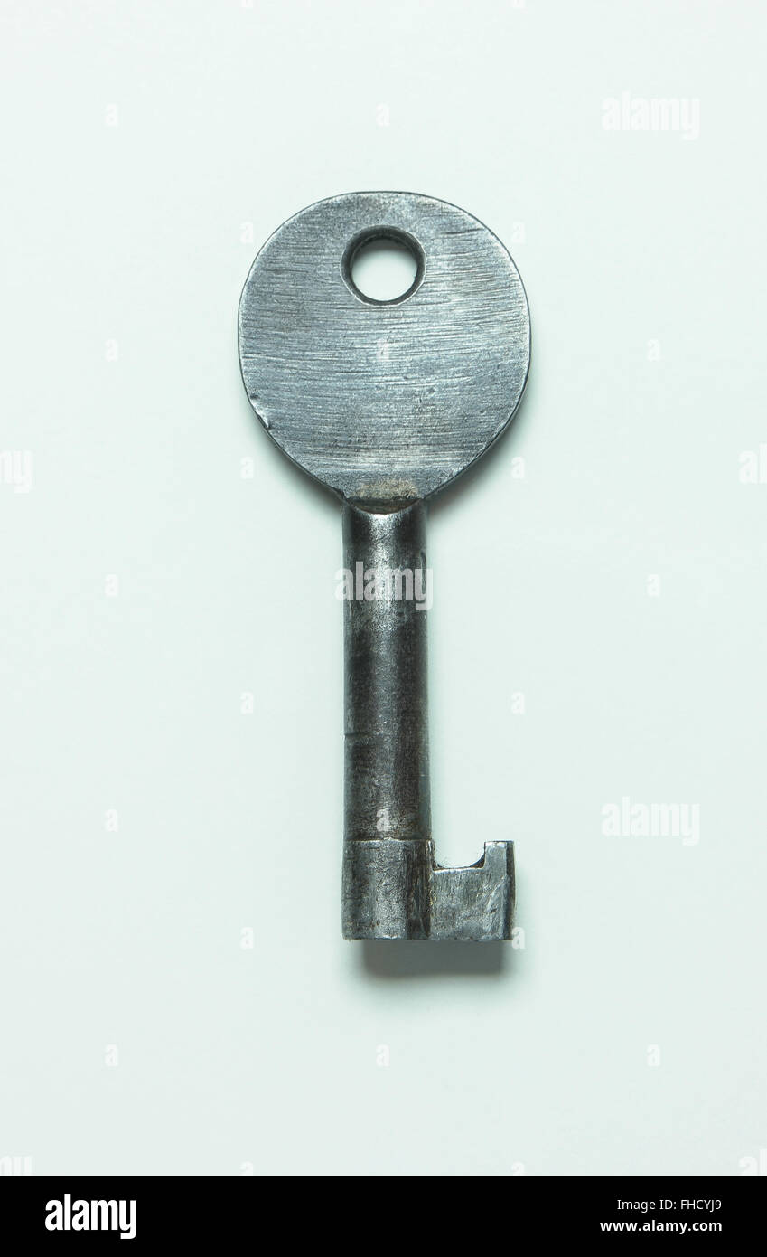 The old key with a white background Stock Photo - Alamy
