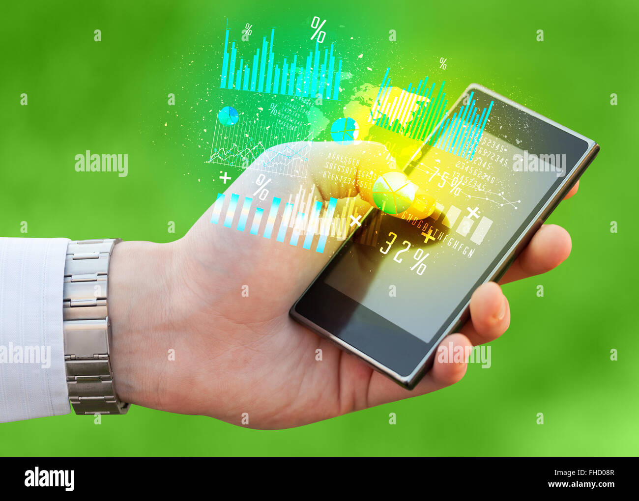 Hand holding smartphone with business diagrams Stock Photo - Alamy