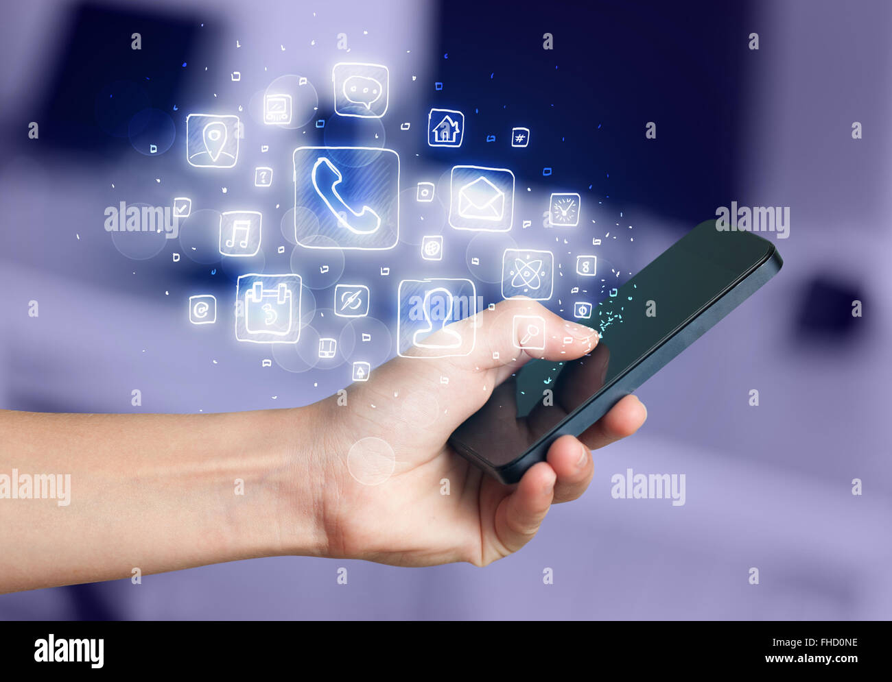 Hand holding smartphone with mobile app icons Stock Photo - Alamy
