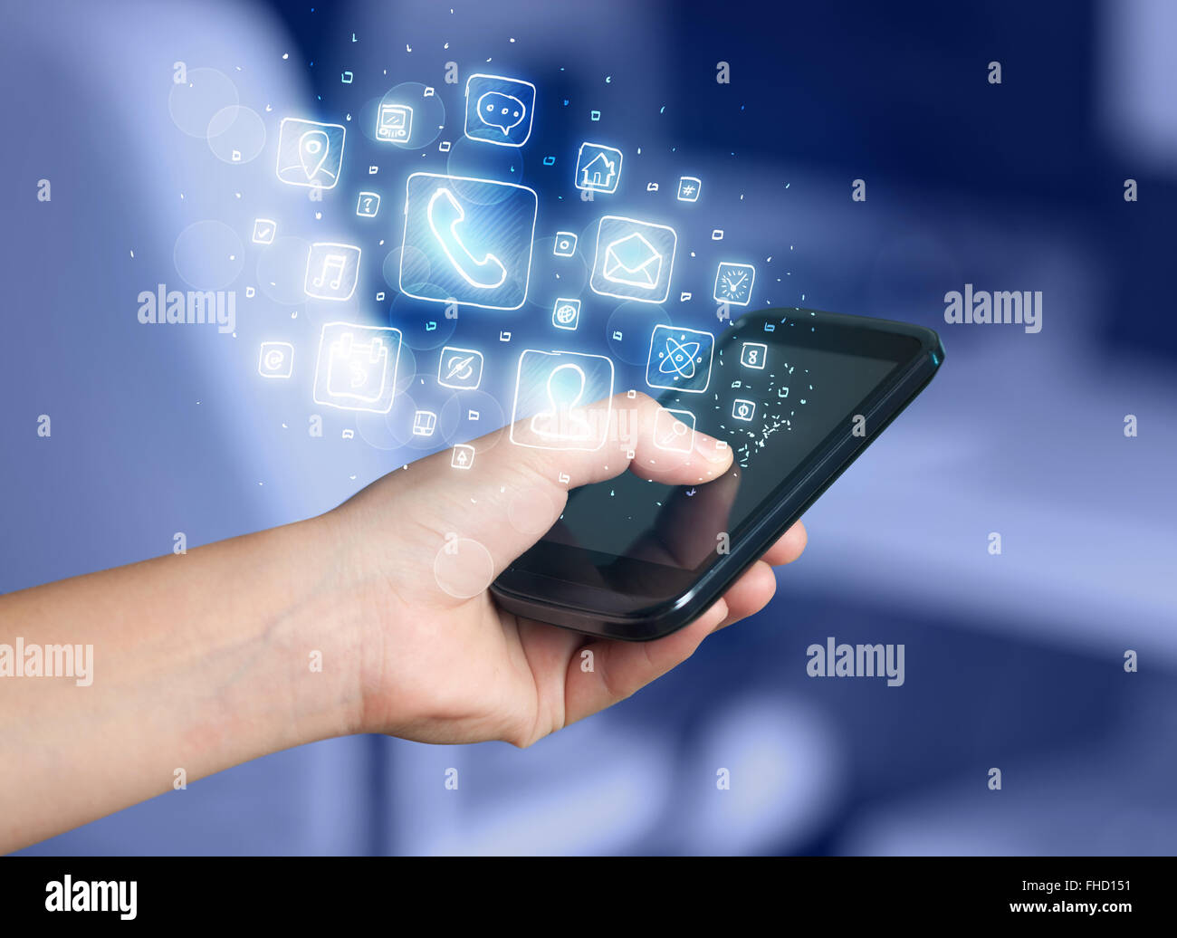 Hand holding smartphone with mobile app icons Stock Photo - Alamy