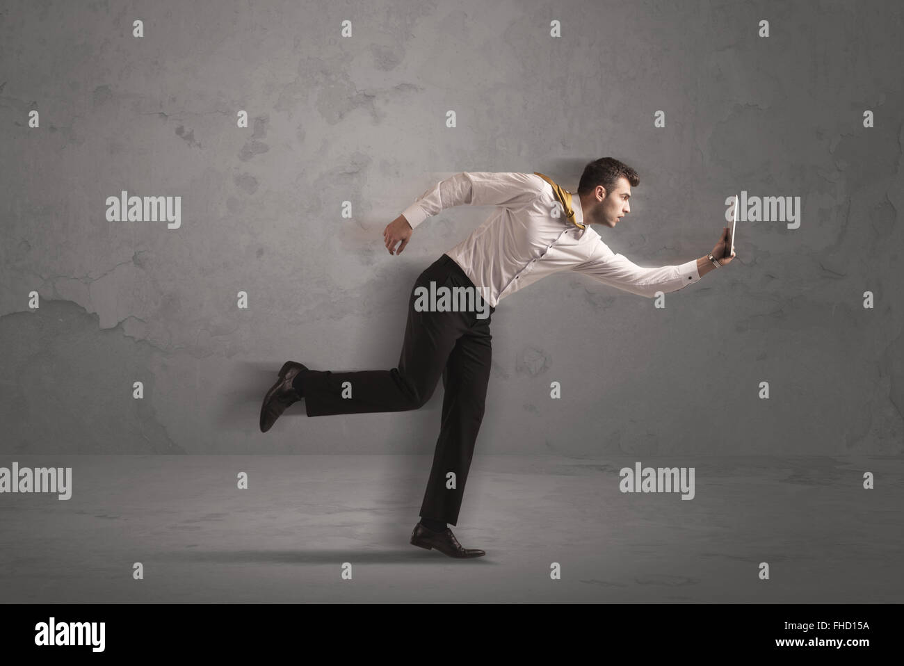 Running businessman device hand hi-res stock photography and images - Alamy