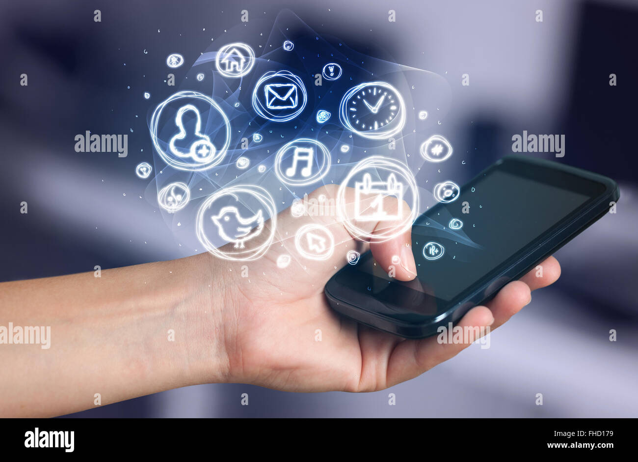 Hand holding smartphone with mobile app choices Stock Photo - Alamy