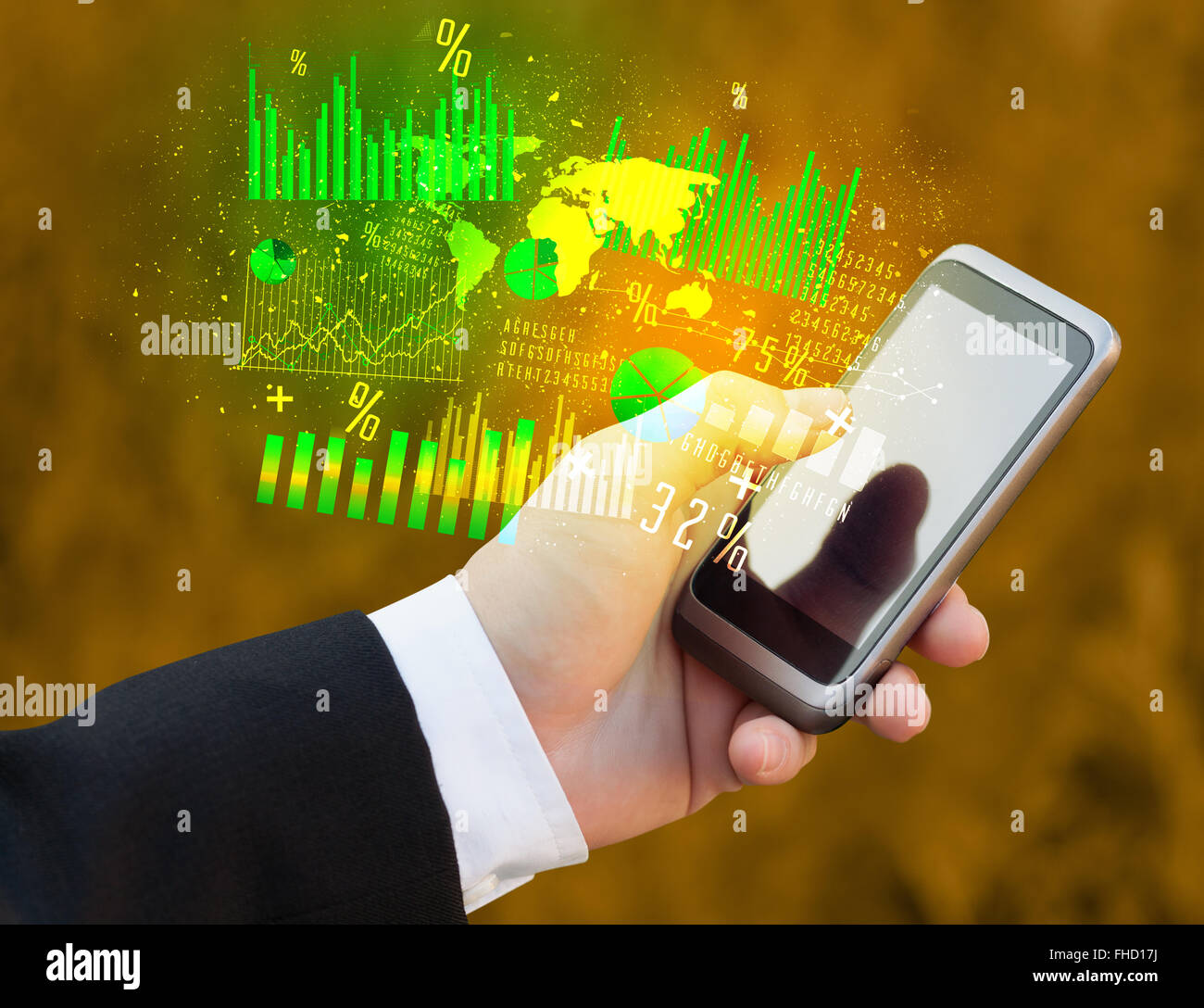 Hand holding smartphone with business diagrams Stock Photo - Alamy