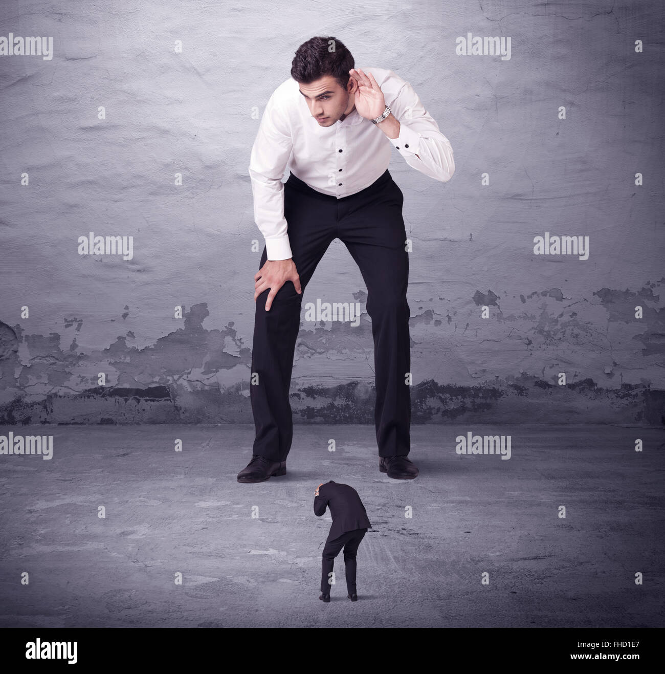 Angry big manager looking at small business man Stock Photo - Alamy