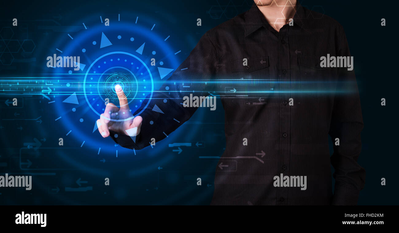Handsome tech guy pressing high technology control panel screen concept ...