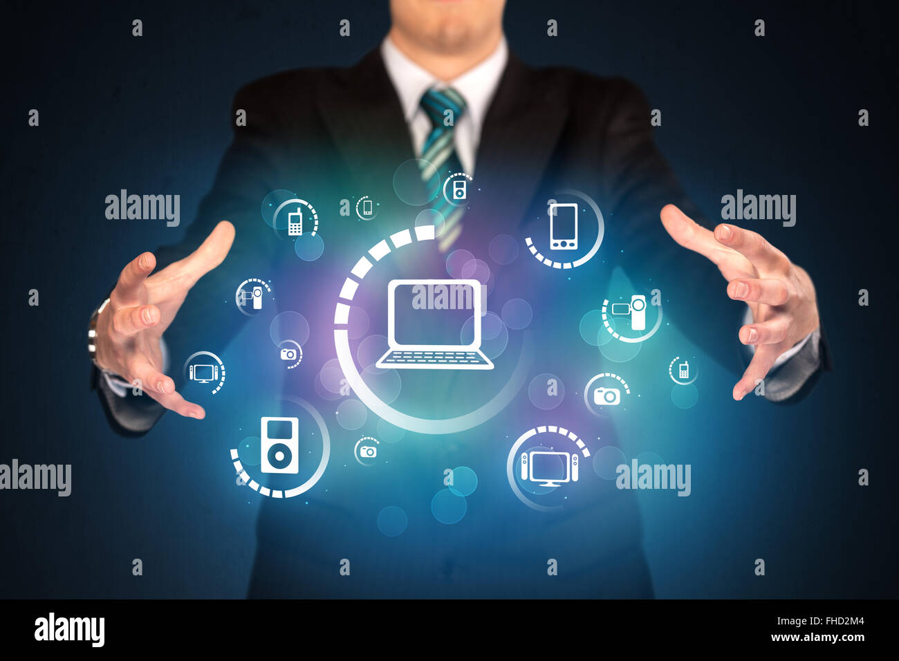 holding digital media icons Stock Photo - Alamy