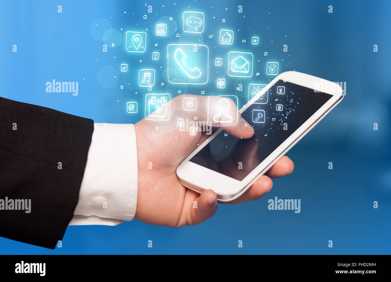 Hand holding smartphone with mobile app icons Stock Photo - Alamy