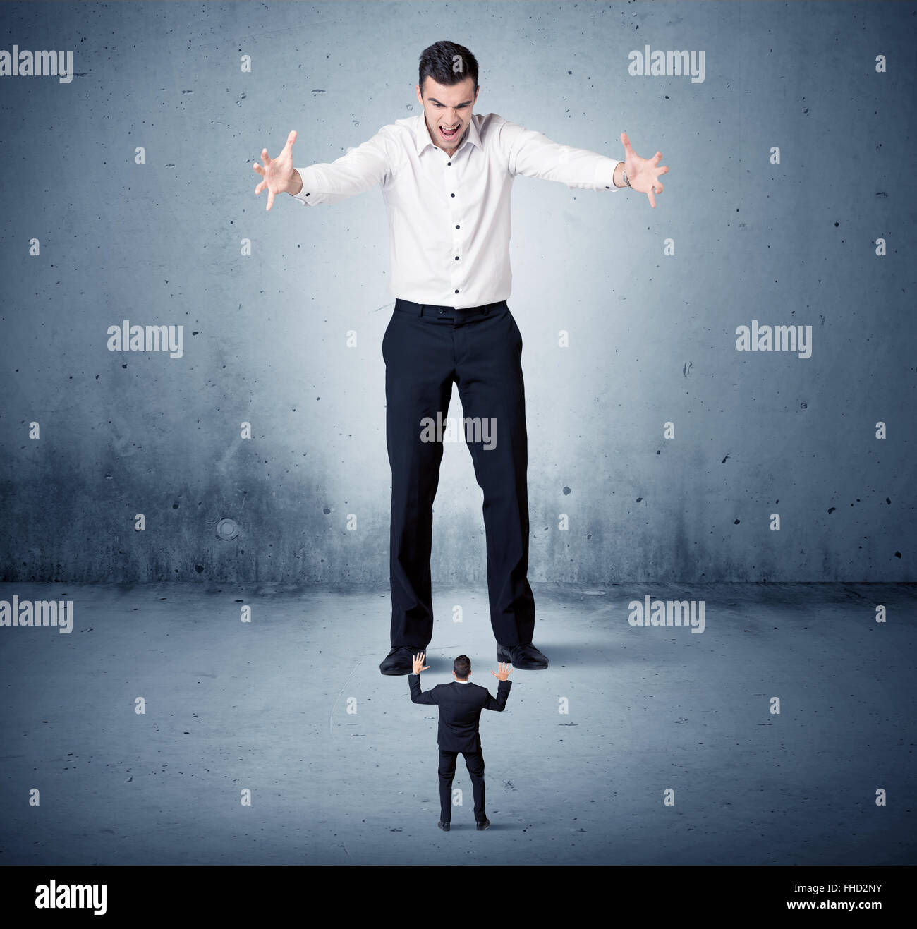Angry huge business man lokking at small guy Stock Photo - Alamy
