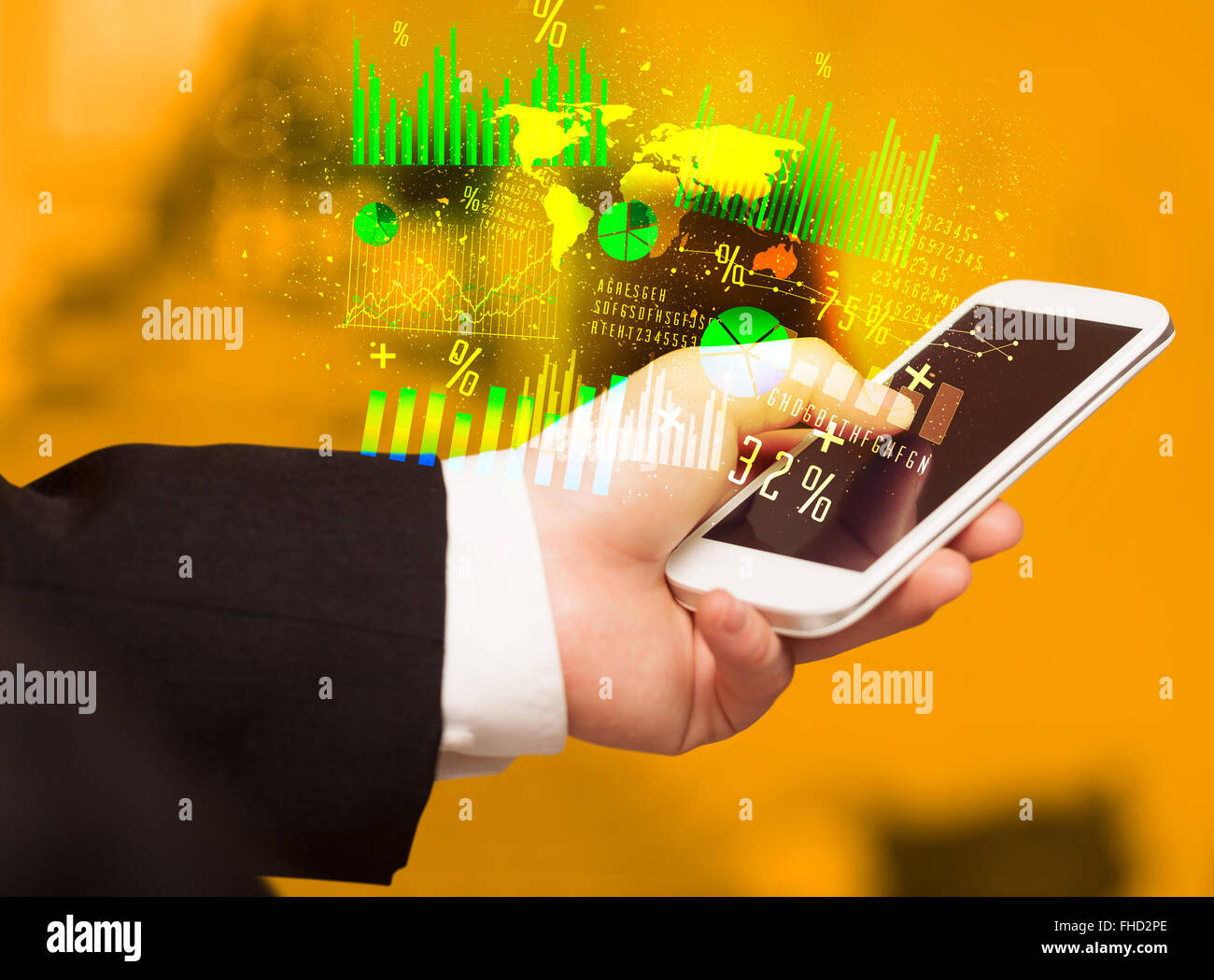 Hand holding smartphone with business diagrams Stock Photo - Alamy