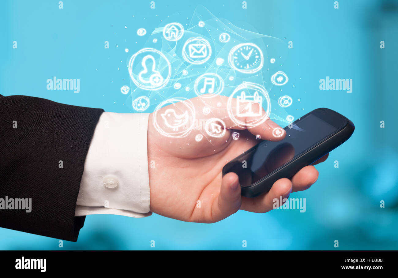 Hand holding smartphone with mobile app choices Stock Photo - Alamy