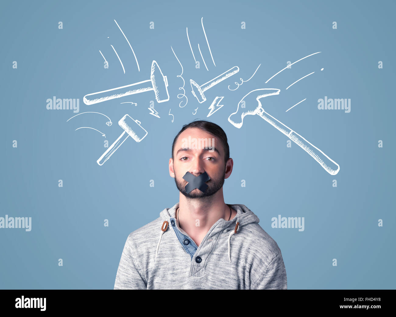 Young man with glued mouth and beating hammer marks Stock Photo - Alamy