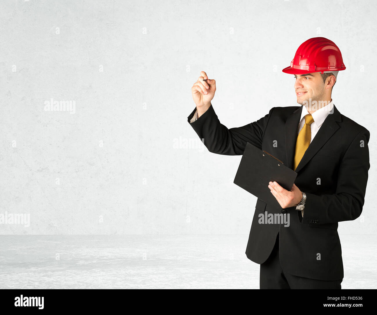 Young architect drawing in empty space Stock Photo - Alamy