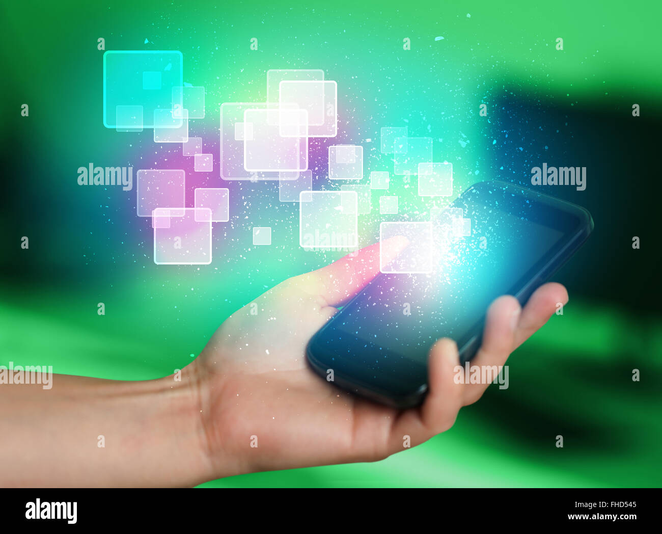 Hand holding smart phone with abstract glowing squares Stock Photo - Alamy
