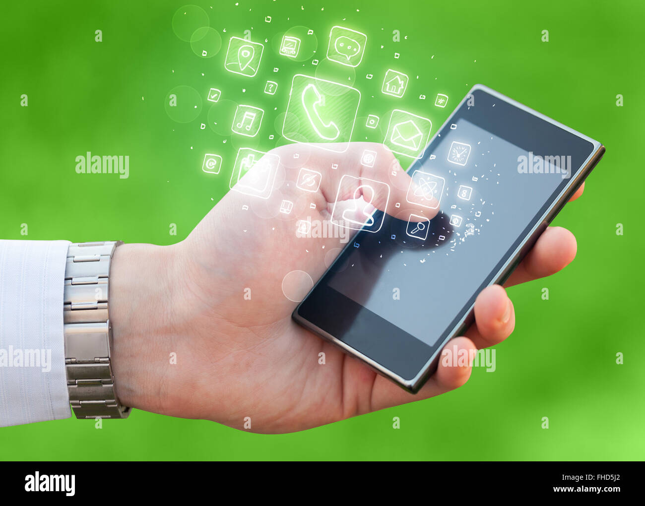 Hand holding smartphone with mobile app icons Stock Photo - Alamy