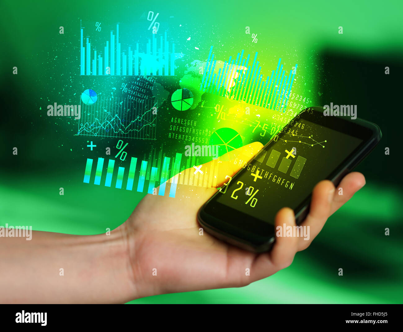 Hand holding smartphone with business diagrams Stock Photo - Alamy