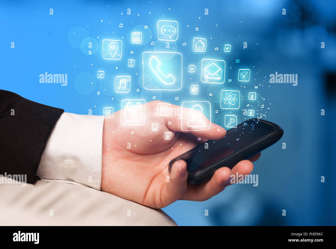 Hand holding smartphone with mobile app icons Stock Photo - Alamy