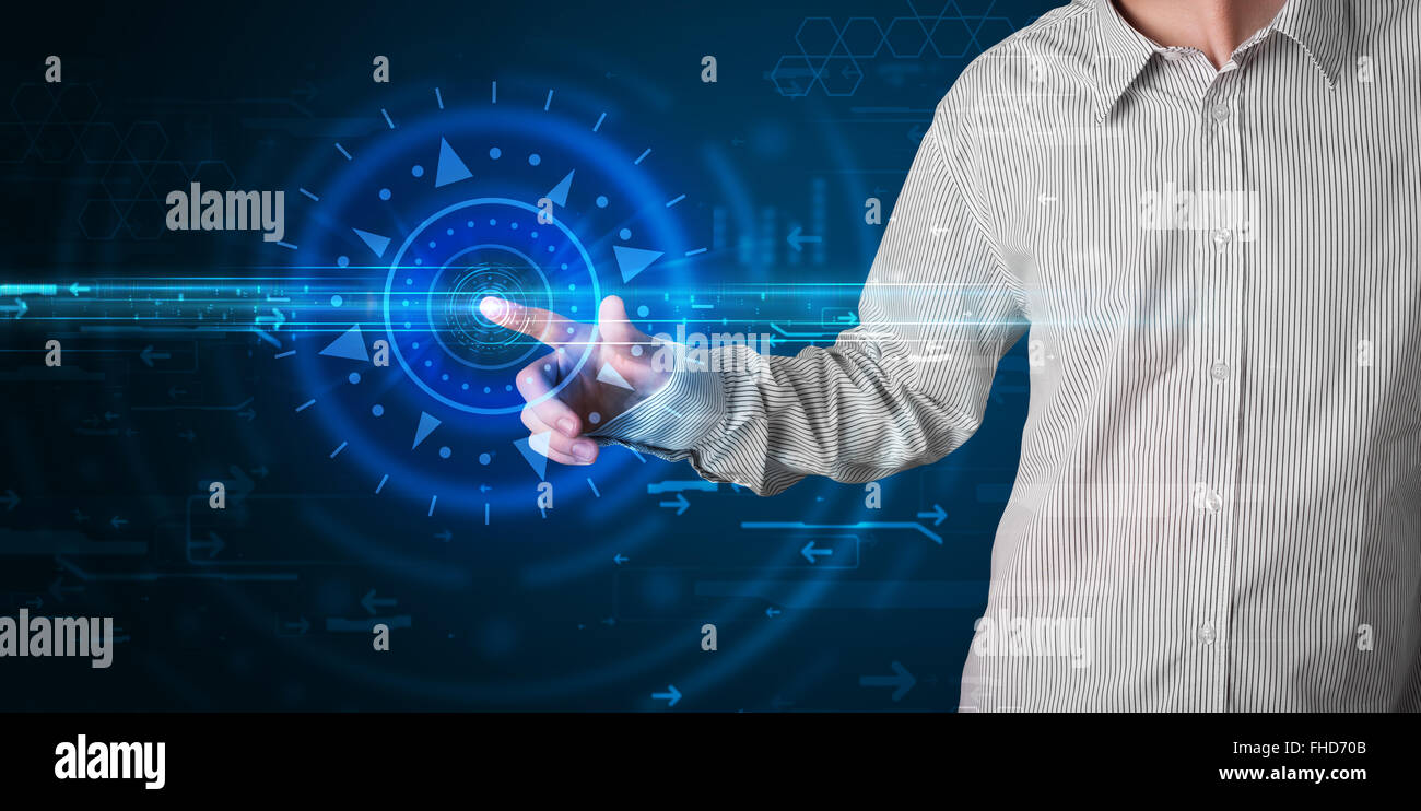 Handsome tech guy pressing high technology control panel screen concept ...