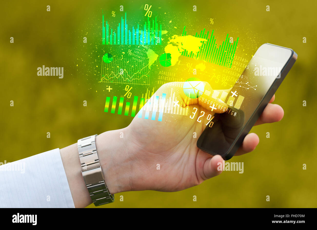 Hand holding smartphone with business diagrams Stock Photo - Alamy