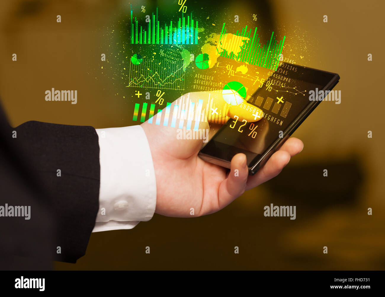 Hand holding smartphone with business diagrams Stock Photo - Alamy