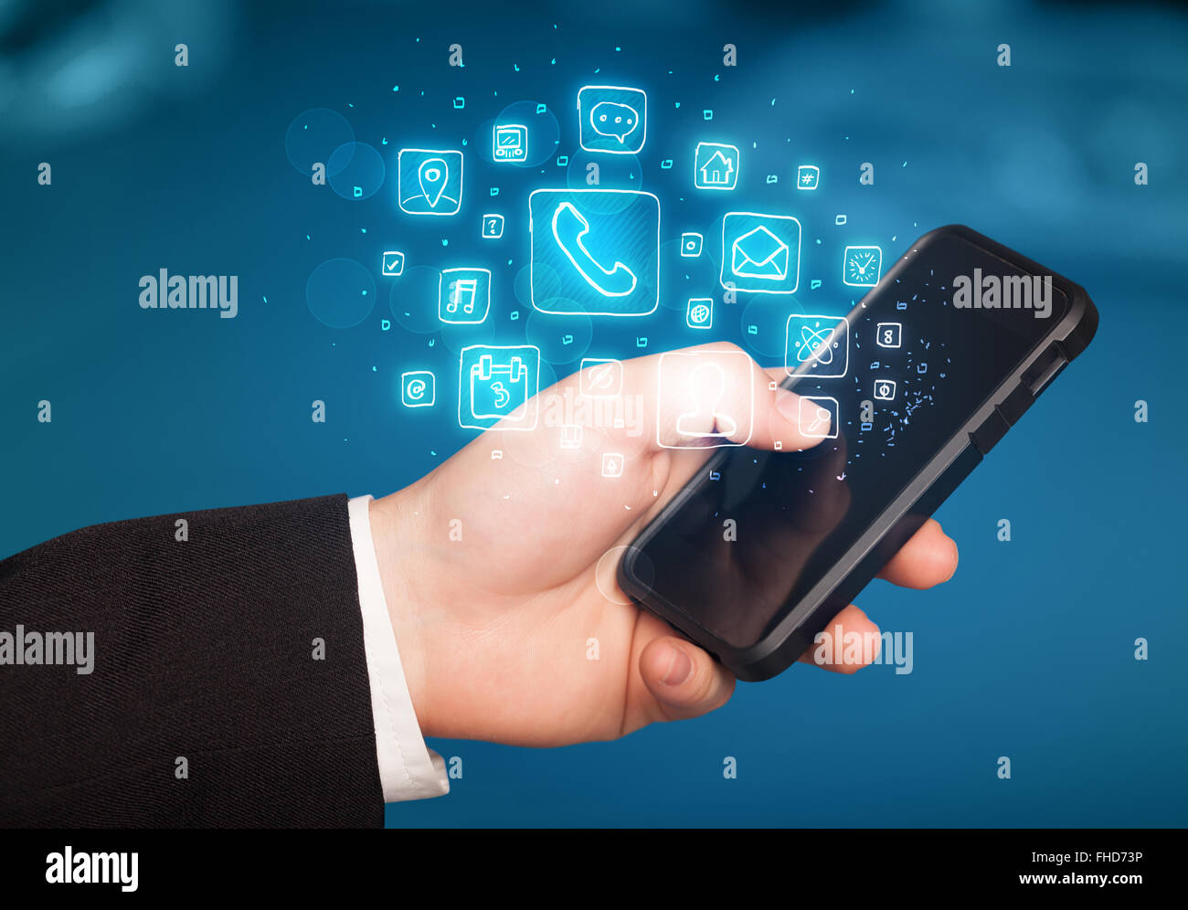 Hand holding smartphone with mobile app icons Stock Photo - Alamy
